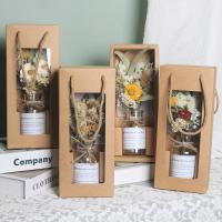 China Travel Agency Delight Goddess Day Gift Carnation Dried Flower Bouquet in Glass Bottle for sale