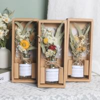 China Travel Agency Delight Goddess Day Gift Carnation Dried Flower Bouquet in Glass Bottle for sale