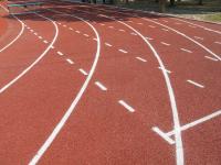 China Low Maintenance Permeable Running Track No Blistering Durable Synthetic Surface Solutions for sale