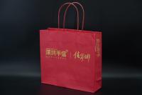 China recycled Eco Paper Bags Hot Stamping Red Kraft Bags With Handles Twisted for sale