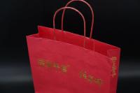 China recycled Eco Paper Bags Hot Stamping Red Kraft Bags With Handles Twisted for sale