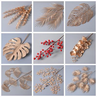 China Golden artificial eucalyptus gingko Persian Leaf Areca Palm Monstera with Red Cherries for sale