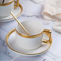 China Matte White Ceramic Porcelain Coffee Tea Cups Saucers Sets With Gold Handle 250ml Volume for sale