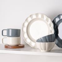 China Solid Color Dinnerware Set Nordic Style Ceramic Plates And Bowls With Sunflower Shape for sale
