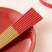China Party Essential Stainless Steel Gold Spoon Set With Red Chopsticks Chinese Style for sale