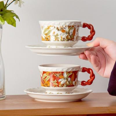 China Business Gifts Ceramic Floral Cup Set Gift Box Porcelain Irregular Mug And Saucer White for sale
