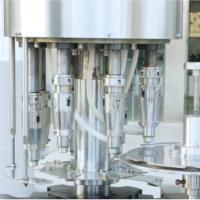 China Full Automatic Rotary Capping Machine 8 Heads 8000 BPH for 80ml-1000ml Bottles for sale