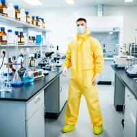China Disposable Chemical Protective Suit with Double Closure, Chemical Resistant Material, and High-Visibility Yellow for Industrial Safety for sale