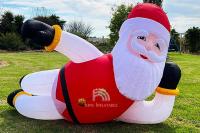 China Christmas Inflatable Snowman 3.6m X 2.0m Outdoor Decorations Air Blown Santa Claus Reclining On The Ground for sale
