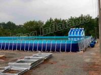 China Large Frame Pool / Rainbow Slide Amazing Inflatable Water Park For Entertainment for sale