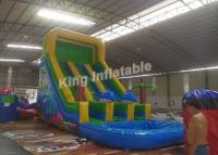 China Eye Catching Green Double Lane Inflatable Water Slide With Swimming Pool for sale