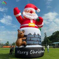 China 20FT 26ft 33ft Inflatable Santa Claus In Chimney With Reindeer Outdoor Christmas Decoration Blow Up Santa Claus for sale