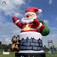 China 20FT 26ft 33ft Inflatable Santa Claus In Chimney With Reindeer Outdoor Christmas Decoration Blow Up Santa Claus for sale
