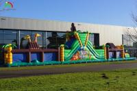 China Large Outdoor Inflatable Obstacle Course With Slide And Fence Jumping Bounce Sports Game With Trampoline And Slide for sale