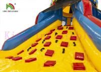 China PVC Colorful Blow Up Carousel Dry Slide Tower Slide With Climbing Wall For Kids for sale