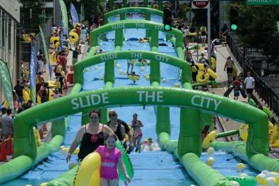 China Customized 100m Long Outdoor Inflatable Water Sports Game City Slide For Adults for sale