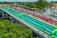 China Customized 100m Long Outdoor Inflatable Water Sports Game City Slide For Adults for sale