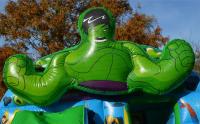 China Kids Inflatable Green Super Heroes Castle Jumping House With Slide for sale