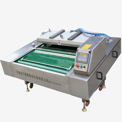 China Automatic Food Industrial Continuous Rolling Vacuum Packing Machine 1100mm Vacuum Sealing Machine for sale