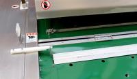 China Single Strip YF-1000 Automatic Rolling Continuous Belt Vacuum Sealing Machine for Food for sale