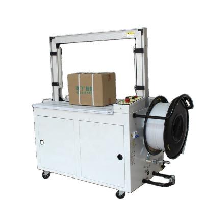China Fully Automatic High Desk Carton Strapping Machine With Strap Size W 9-15mm /T 0.6-1mm for sale
