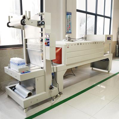 China 750 50mm Worktable Height Semi Automatic PET Bottle Shrink Wrap Machine for Water Bottles for sale