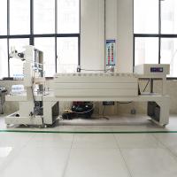 China 180 KG PET Bottle Shrink Tunnel Wrapping Machine for Automatic Water Bottle Packaging for sale