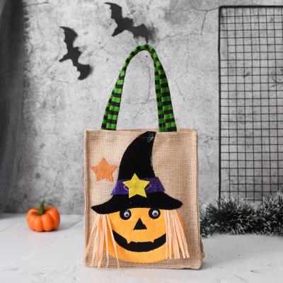 China Halloween Theme 26*15cm Linen Witch Pumpkin Candy Gift Bag for Daily Necessities for sale