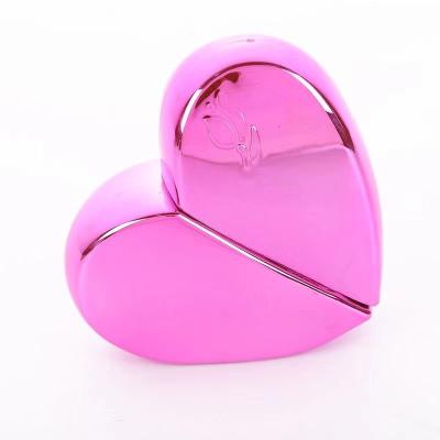 China 30ML Heart-Shaped Glass Perfume Sprayer Bottle with Custom Painting Options for Luxury Fragrance Packaging for sale