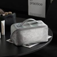 China Women's Large Capacity Portable Luxury Makeup Bags 2025 New Silver Waterproof Toiletry Travel Daily Organizer Cosmetic Pouch for sale