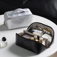 China Women's Large Capacity Portable Luxury Makeup Bags 2025 New Silver Waterproof Toiletry Travel Daily Organizer Cosmetic Pouch for sale