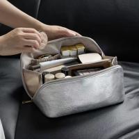 China Women's Large Capacity Portable Luxury Makeup Bags 2025 New Silver Waterproof Toiletry Travel Daily Organizer Cosmetic Pouch for sale