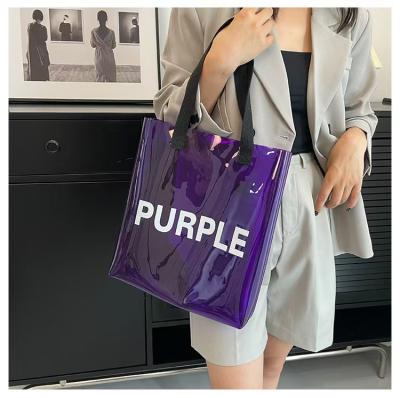 China Custom Logo Jelly Color Pouch Glossy PVC Clear Handheld Shopping Bags Classic Purple Gift Packaging Waterproof Carry Bags for sale