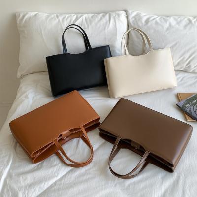 China Minimalist Solid-Color Women's Tote Bag Premium-Quality PU Leather Handbag for Daily Commuting Large Capacity Carryall with LOGO for sale