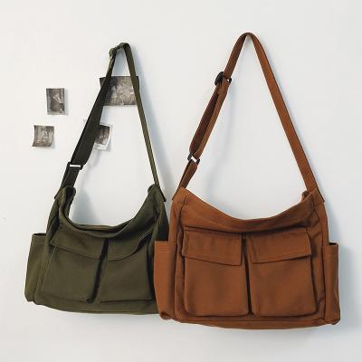 China Customizable Large-Capacity Multi-Pocket Canvas Tote Bag for Men and Women Versatile Street Style Tote Bag Simple Casual Travel for sale