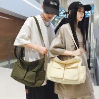 China Customizable Large-Capacity Multi-Pocket Canvas Tote Bag for Men and Women Versatile Street Style Tote Bag Simple Casual Travel for sale