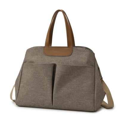 China Customized New Japanese Fashion Handheld Bag Large Capacity Tote Wrist Bags Oxford Made Lightweight Maternity Outing Storage Bag for sale