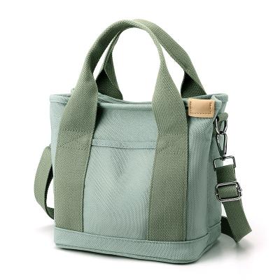China Small Zippered Japanese Layered Bag Niche Ladies' Shoulder Tote Bag Handheld Thickened Canvas Phone Bucket Tote Bags with Logo for sale