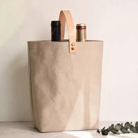China Customized Champagne Wine Handheld Bags with Logo Printing Washable Tear-resistant Kraft Paper Made Gift Bags for sale