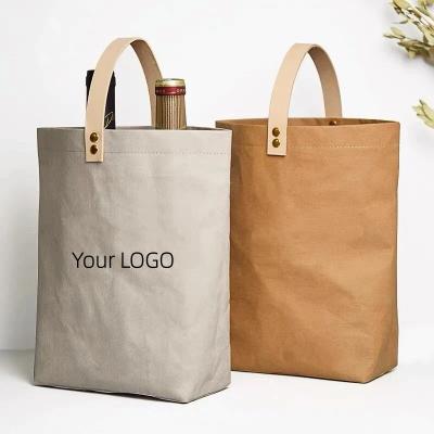 China Customized Champagne Wine Handheld Bags with Logo Printing Washable Tear-resistant Kraft Paper Made Gift Bags for sale