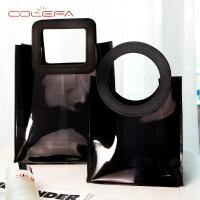 China Customized Black PVC Handheld Bag Glossy Laser Fashion-Style Gift Bag Wedding Favor Handle Open Closure Shopping Bag for sale
