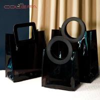 China Customized Black PVC Handheld Bag Glossy Laser Fashion-Style Gift Bag Wedding Favor Handle Open Closure Shopping Bag for sale