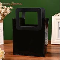 China Customized Black PVC Handheld Bag Glossy Laser Fashion-Style Gift Bag Wedding Favor Handle Open Closure Shopping Bag for sale