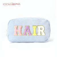 China Customizable Embroidered Letter Storage Pouch Corduroy Made Cosmetic Bag Portable Toiletry Large Capacity Makeup Bags for sale