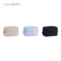 China New Quilted Cosmetic Bag Thickened Quilted Washbag Cotton-Filled Fabric Travel Cosmetics Organizer Portable Storage Bag for sale
