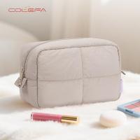 China New Quilted Cosmetic Bag Thickened Quilted Washbag Cotton-Filled Fabric Travel Cosmetics Organizer Portable Storage Bag for sale
