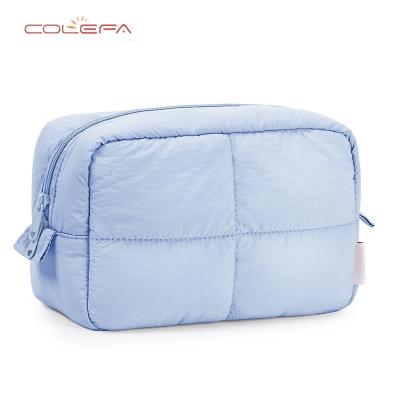 China New Quilted Cosmetic Bag Thickened Quilted Washbag Cotton-Filled Fabric Travel Cosmetics Organizer Portable Storage Bag for sale