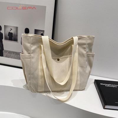 China Large Capacity Tote Canvas Bag Work & Outings Stylish Commuting Versatile Literary Student Style Book-Carrying Shoulder Bags for sale