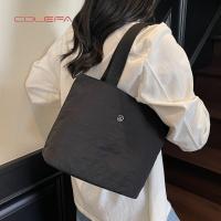 China Customized Casual Lightweight Minimalist Nylon Bag New Women's Tote Bag Simple Mini Versatile Handheld Book Storage Bag for sale
