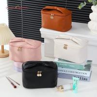 China PU Soft Leather New Arrival Travel Portable Makeup Bags Storage Large Capacity Waterproof Stylish Bow Handle Cosmetic Bag for sale